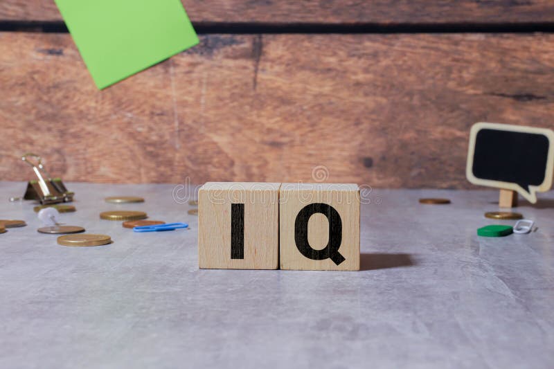 Text IQ on Wooden Cubes on a Pink Background, Copy Space. Coefficient ...