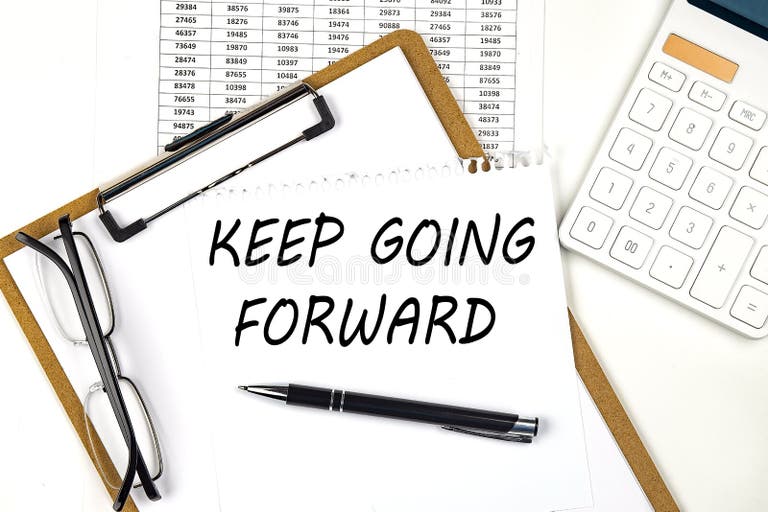 Text KEEP GOING FORWARD on the White Paper on Clipboard with Chart and ...