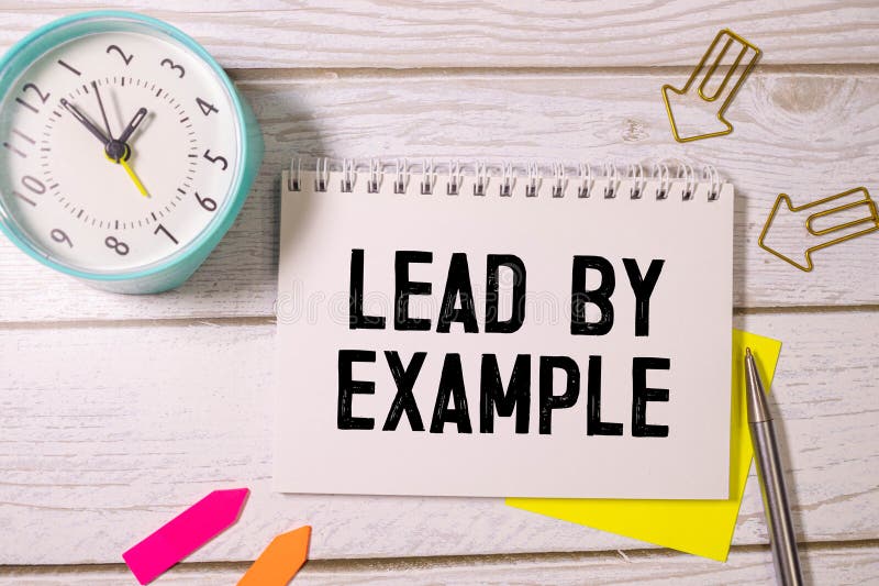 Text LEAD by EXAMPLE on White Paper on Clipboard with Chart and ...