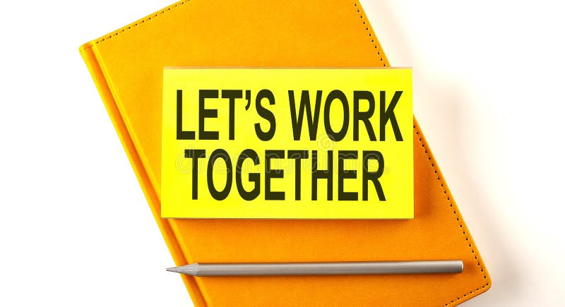 Text LET`S WORK TOGETHER on the Sticker on the Yellow Notebook Stock ...
