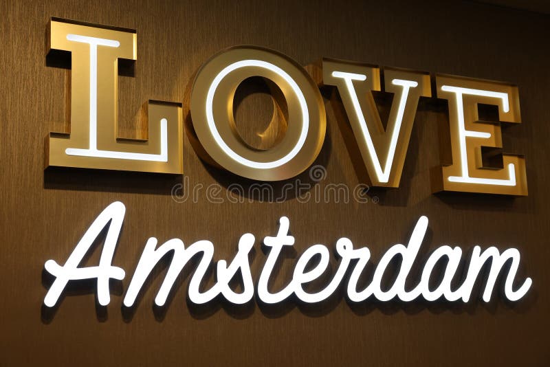 Text "Love Amsterdam" on Wall in Department Store Stock Photo - Image of department, text: 284302816