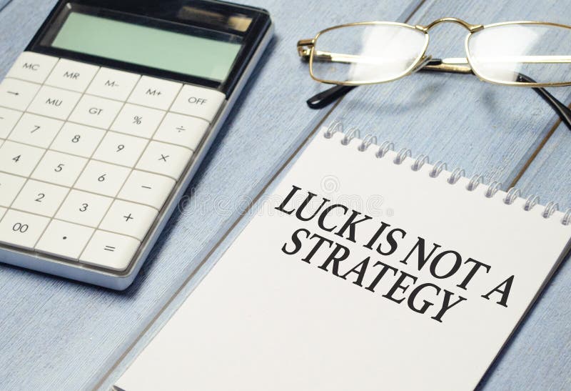 The Text Luck is Not a Strategy on Paper Notepad and Calculator Stock ...