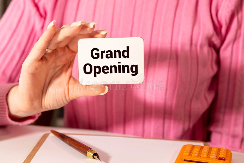 Text Message GRAND OPENING on Brown Torn Paper with Black Backdrop ...