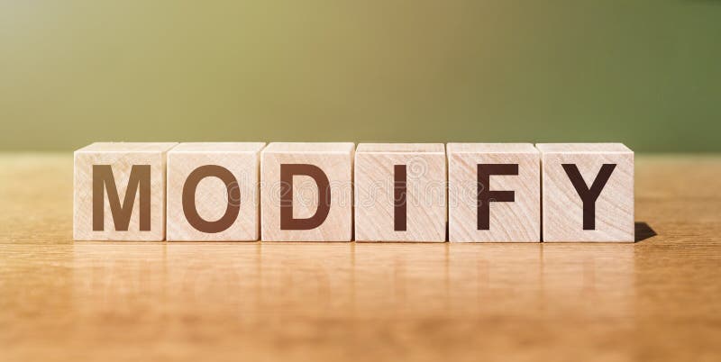 Text of MODIFY on Cubes on a Green-brown Background Stock Image - Image ...