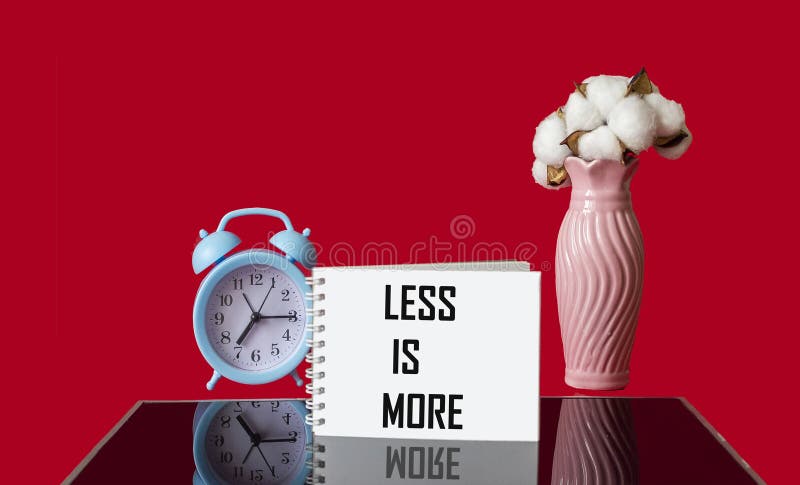 Text less is More Scale Concept on Red and Black Background Stock Photo ...