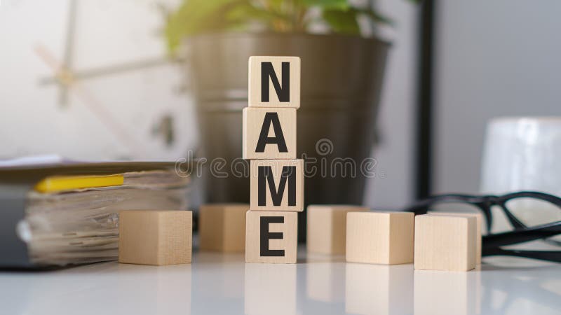 Text Name Written on Wood Cubes that Lie on Wood Cubes. Business ...