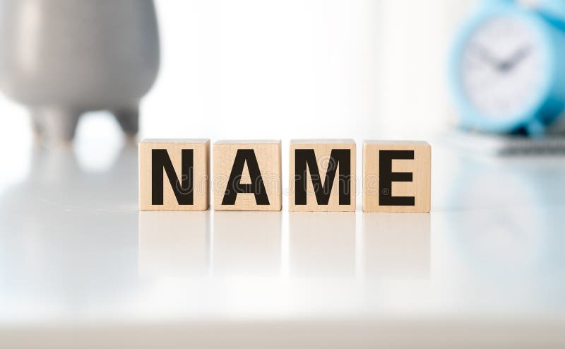 Text Name Written on Wood Cubes that Lie on Wood Cubes. Business ...