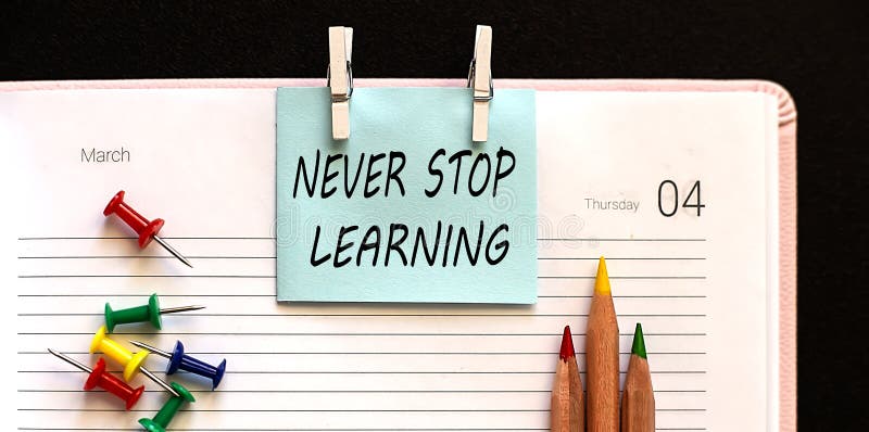 Text Never Stop Learning on the Stickers on the Diary with Office Tools ...