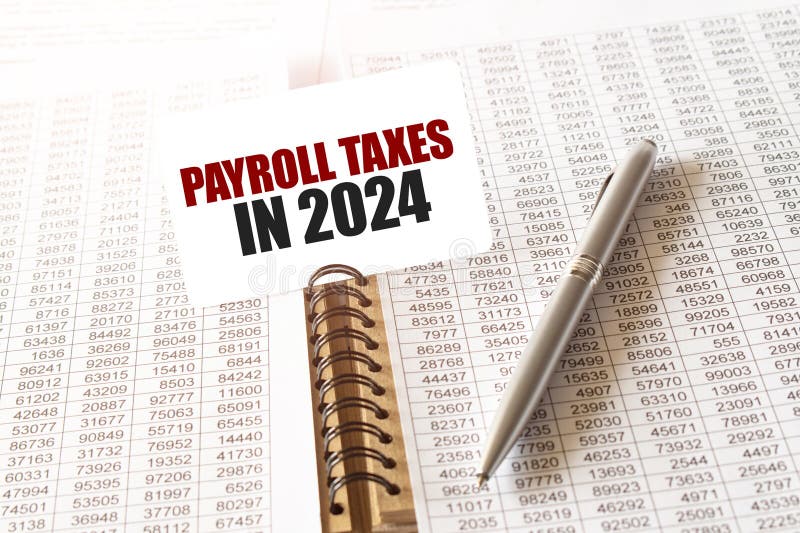 Text PAYROLL TAXES in 2024 on Paper Card, Pen, Financial Documentation ...