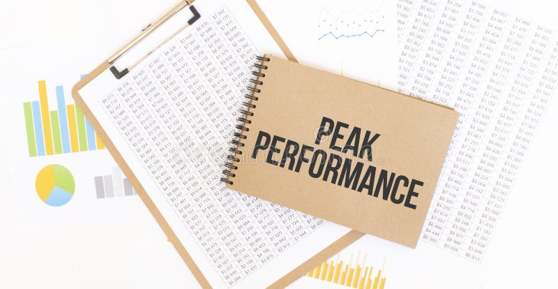 Text PEAK PERFORMANCE on Brown Paper Notepad on the Table with Diagram ...