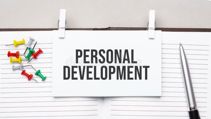 Text Personal Development On Stickers On The Diary With Office Tools ...