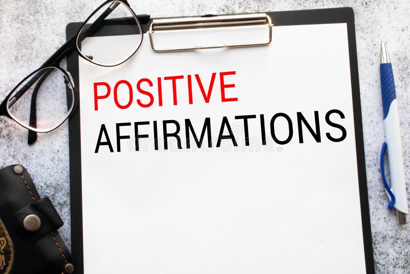 POSITIVE AFFIRMATIONS - Words on a Pink Piece of Paper on a White ...