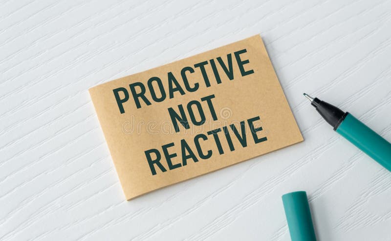 Text Proactive Not Reactive on White Paper Book on Table, Business ...