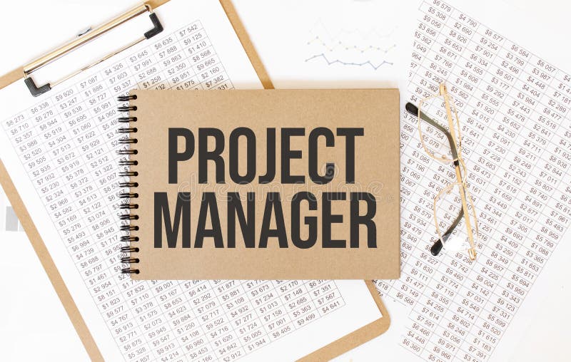 Text PROJECT MANAGER on Brown Paper Notepad on the Table with Diagram ...