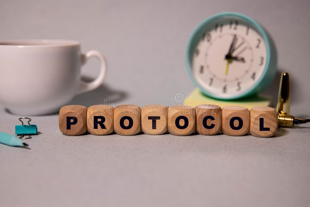 Text PROTOCOL is Written on a Folder Lying on a Stack of Papers with a ...
