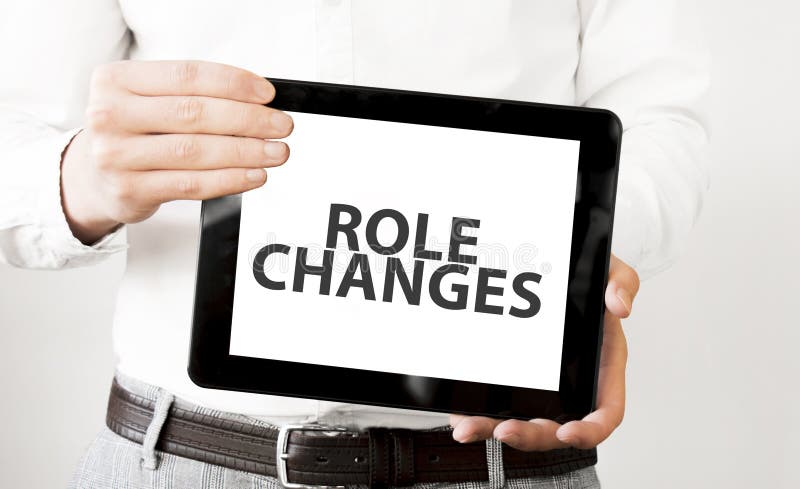 Text Role Changes on Tablet Display in Businessman Hands on the White ...