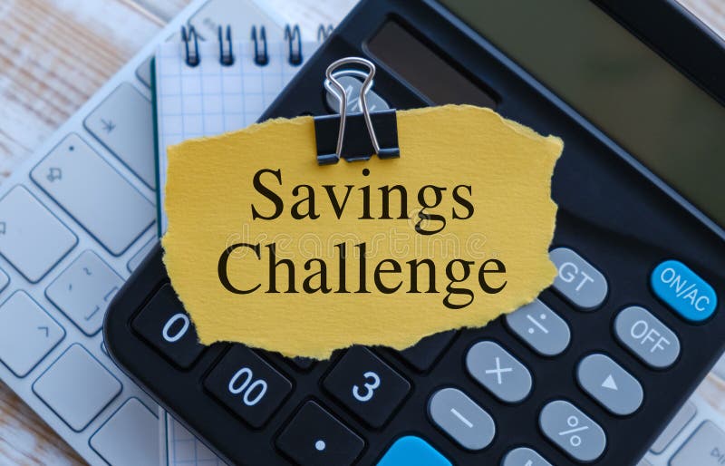 Text Savings Challenge on Torn Piece of Yellow Paper on a Calculator ...