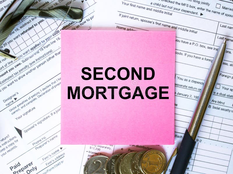 Text Second Mortgage on Note Paper with the U.S IRS 1040 Form,pen and ...