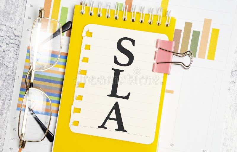 Text SLA Service Level Agreement with Yellow Sticker and Glasses Stock ...