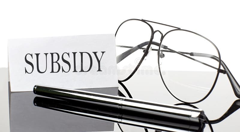 Text SUBSIDY on Paper on Light Background with Pen and Glasses ...