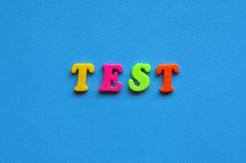 Text Test from Plastic Colored Letters on Blue Paper Background. Stock ...