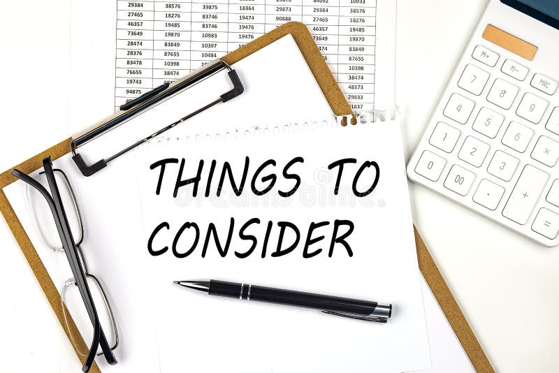 Text THINGS TO CONSIDER on the White Paper on Clipboard with Chart and ...