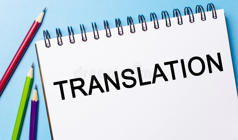 Text TRANSLATION on a White Notepad with Pencils on a Blue Background ...