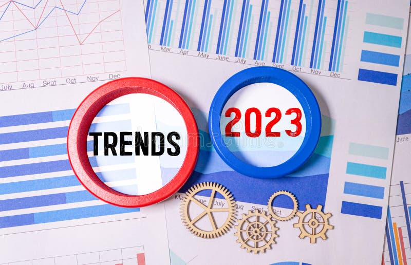 Text TRENDS 2023 on White Paper between White and Brown Spiral Notepads ...
