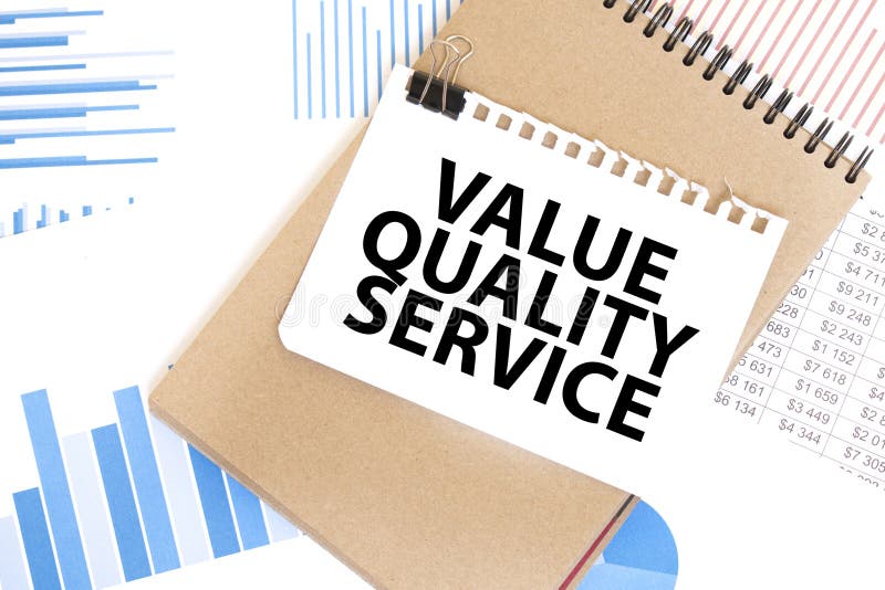 Text Value Quality Service on White Paper Sheet and Brown Paper Notepad ...