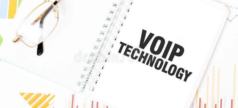 Text VOIP TECHNOLOGY on White Notepad, Glasses, Graphs and Diagrams ...
