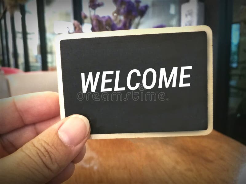 A Hand Hold a Black Card with Text Welcome Stock Image - Image of ...