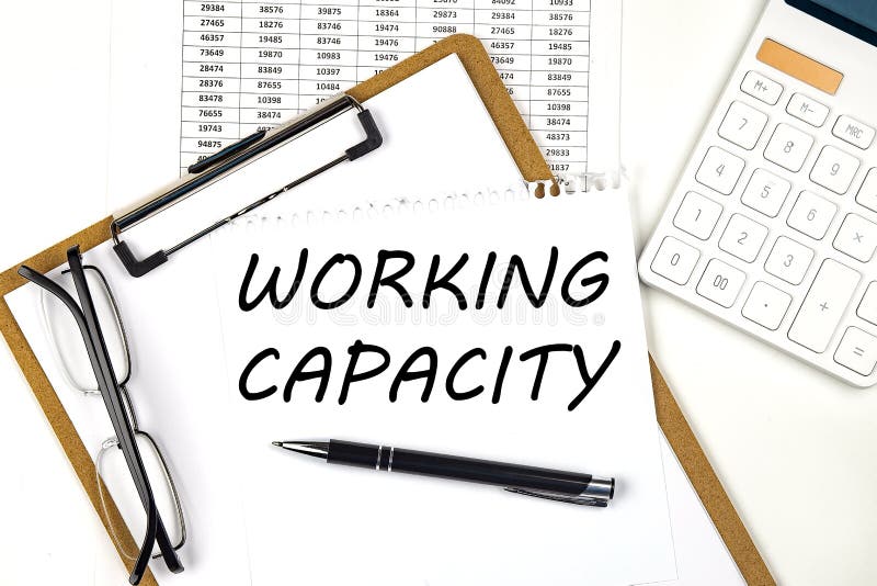 Text WORKING CAPACITY on the White Paper on Clipboard with Chart and ...