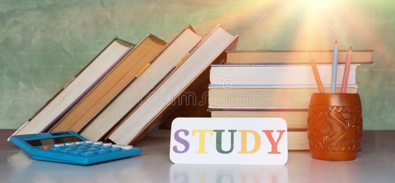 Textbooks on Desk in Front of Blurred Blackboard Stock Image - Image of ...