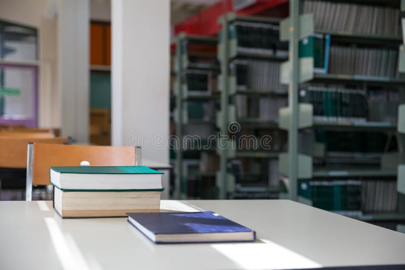 Textbooks on Table in Library Stock Photo - Image of education, thesis ...