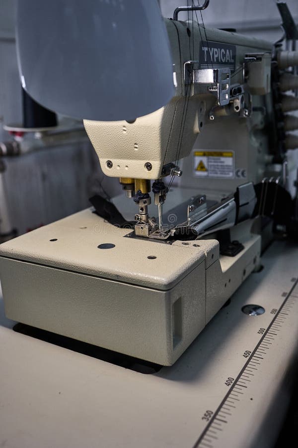 Textile Worker Operating an Industrial Sewing Machine Stock Image ...