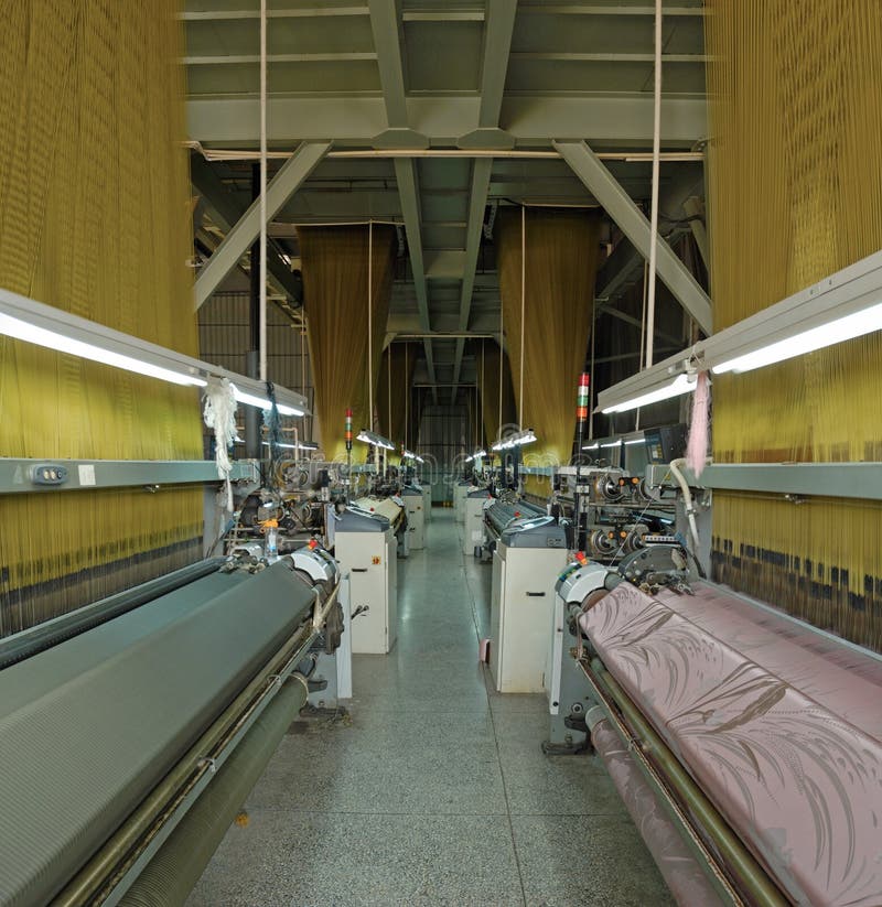 A Silk Maker Examines His Work at a Small Factory in Varanasi, India ...