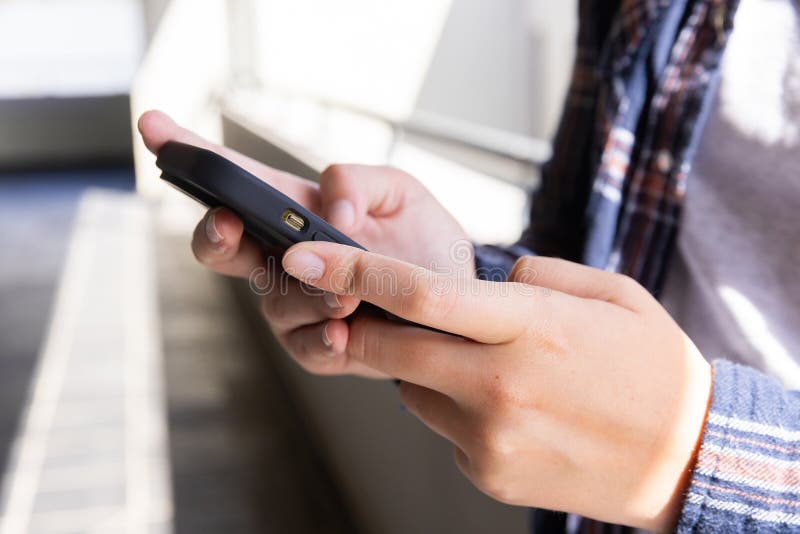 Texting and Browsing Internet, Teenage Girl Using Smartphone during ...