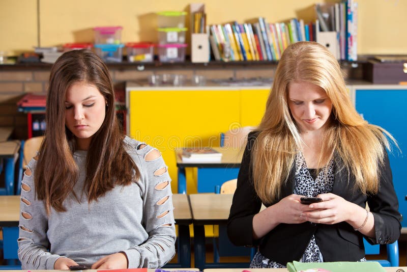 Texting in classroom stock image. Image of students, brunette - 17522809