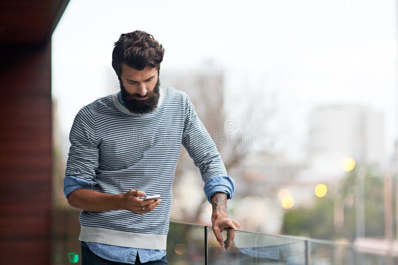 Texting a Client with the Latest Updates. a Young Creative Texting on a ...