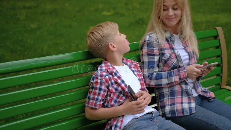 Texting Communication Mom Son Sitting Bench Phone Stock Video - Video ...