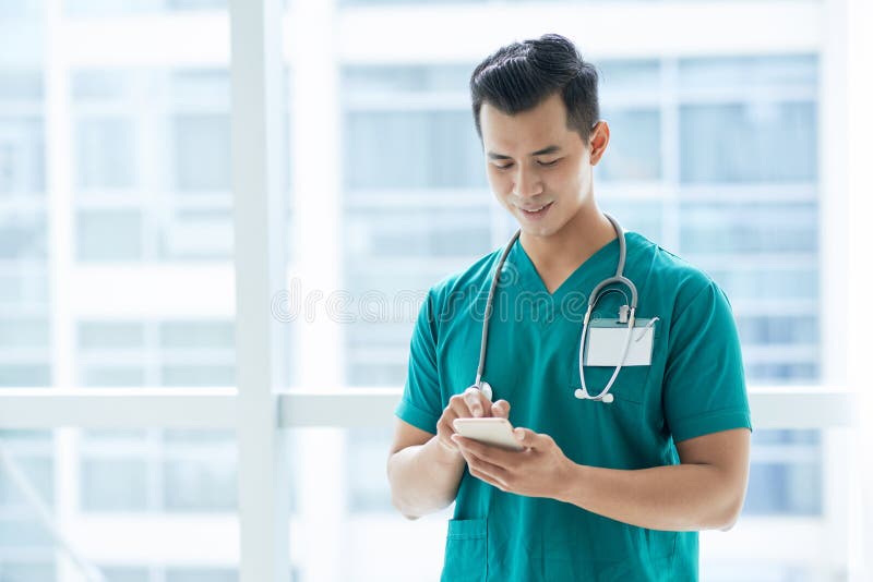 Texting doctor stock image. Image of connection, standing - 127375777