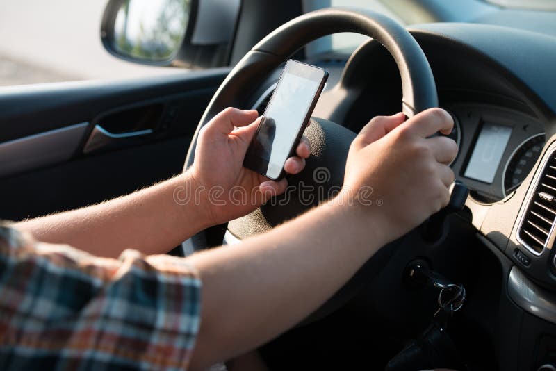 Teen Texting while Driving stock photo. Image of message - 14025096