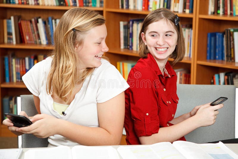 Texting Teenagers stock image. Image of message, school - 19932741