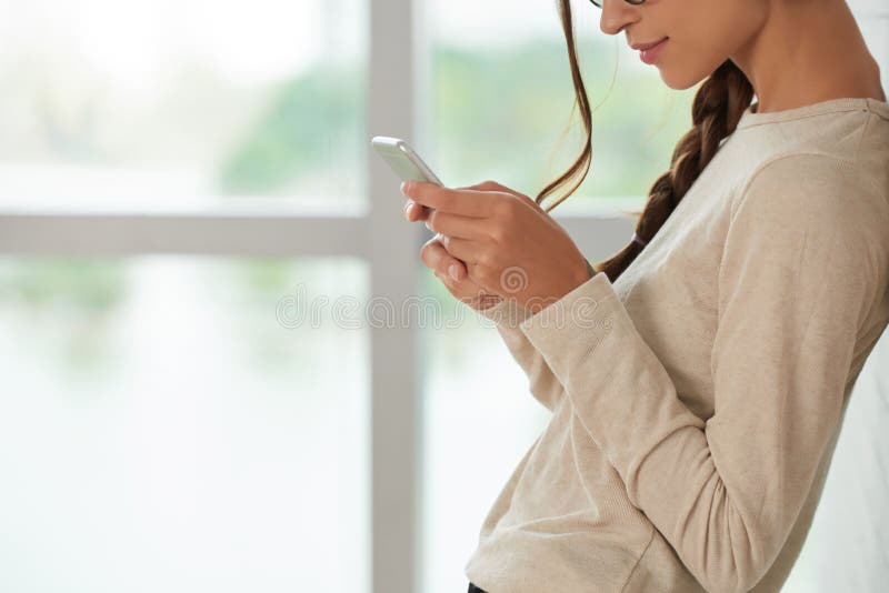 Texting woman stock image. Image of wall, student, glasses - 94003317