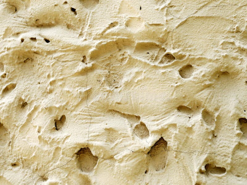 Textura De Una Pared De La Arcilla Del Color Ocre Iluminada Foto de ...