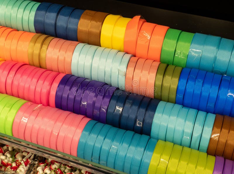 Textural Silk Ribbons on a Shelf in a Store. Multi-colored Ribbons in ...
