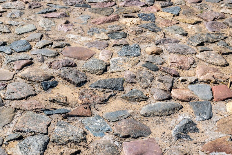The Texture of an Ancient Road with Paving Stones. Natural Stone ...