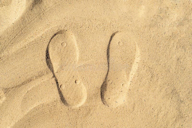 Texture Background Footprints of Human Feet on the Sand Near the Water ...