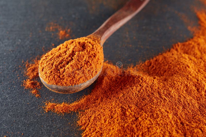 Texture Background. Red Chilli Pepper Powder Mixed with Wooden Spoon ...
