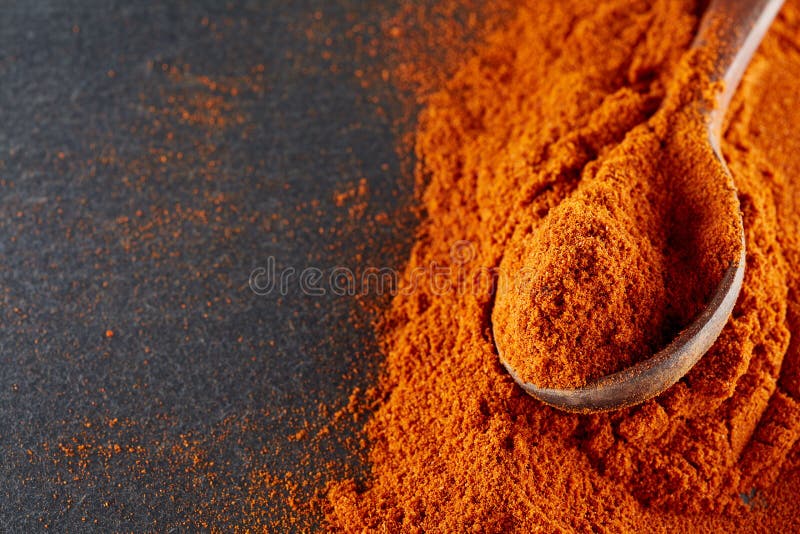 Texture Background. Red Chilli Pepper Powder Mixed with Wooden Spoon ...